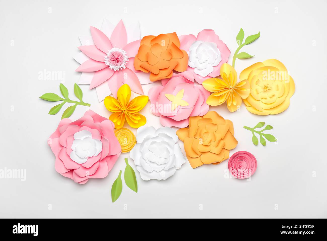 Beautiful handmade paper flowers on light background Stock Photo - Alamy