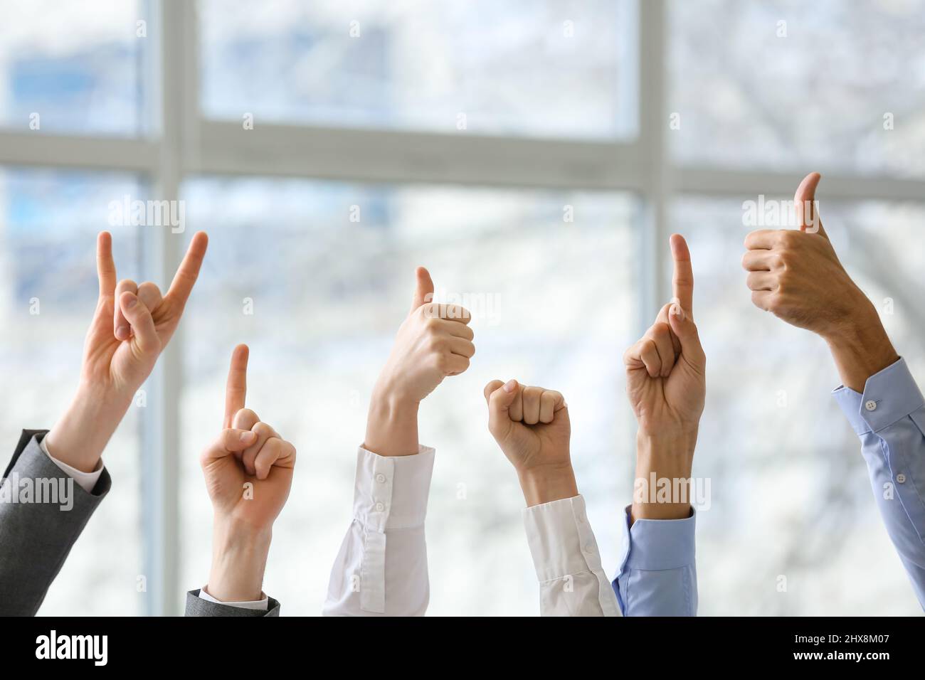 Gesturing business people's hands in office Stock Photo - Alamy