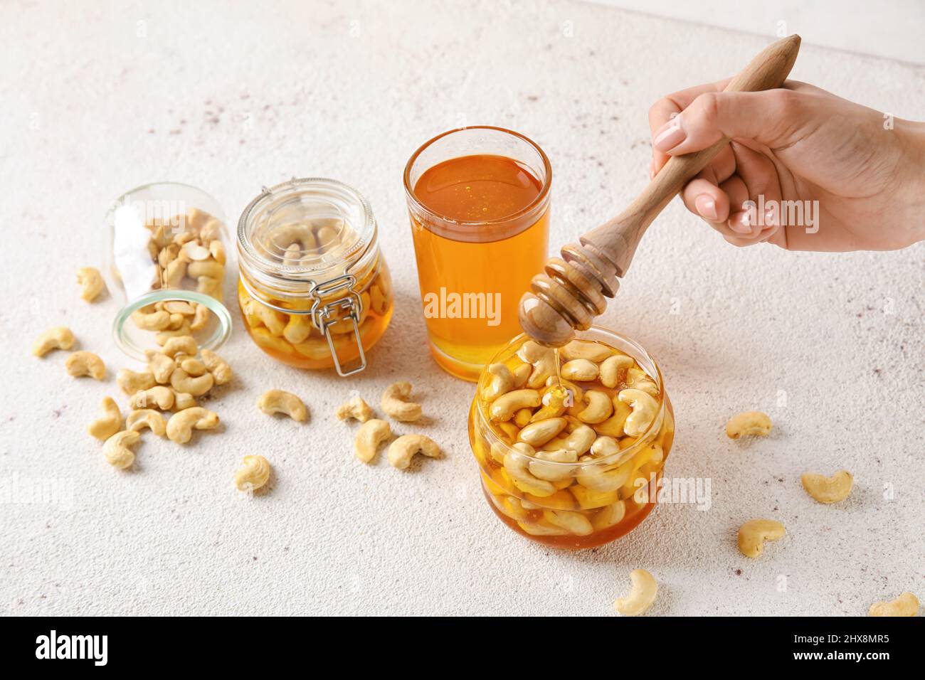 Hand in jar of nuts hi-res stock photography and images - Alamy