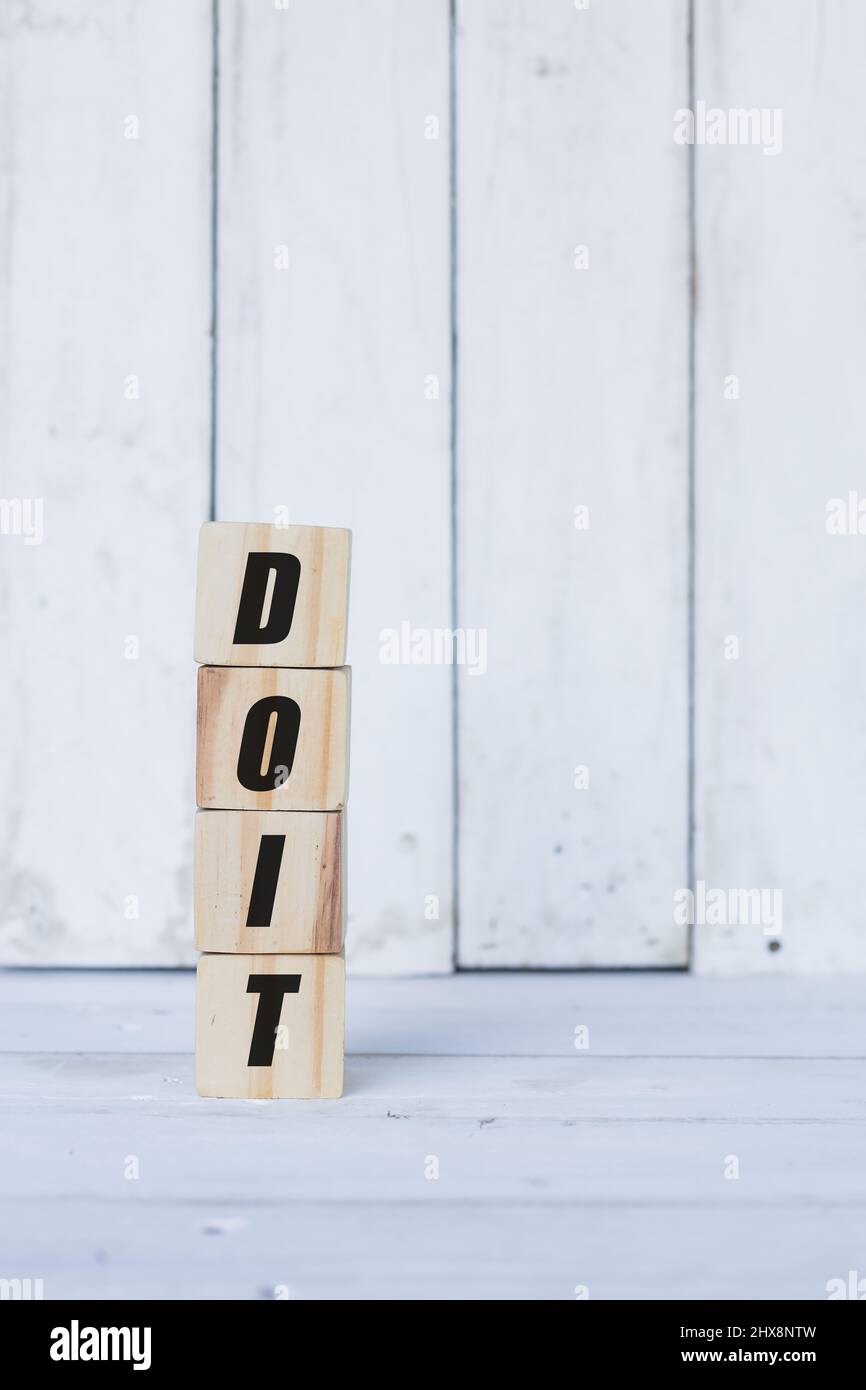 do it word or concept on wooden blocks, white wood background Stock ...