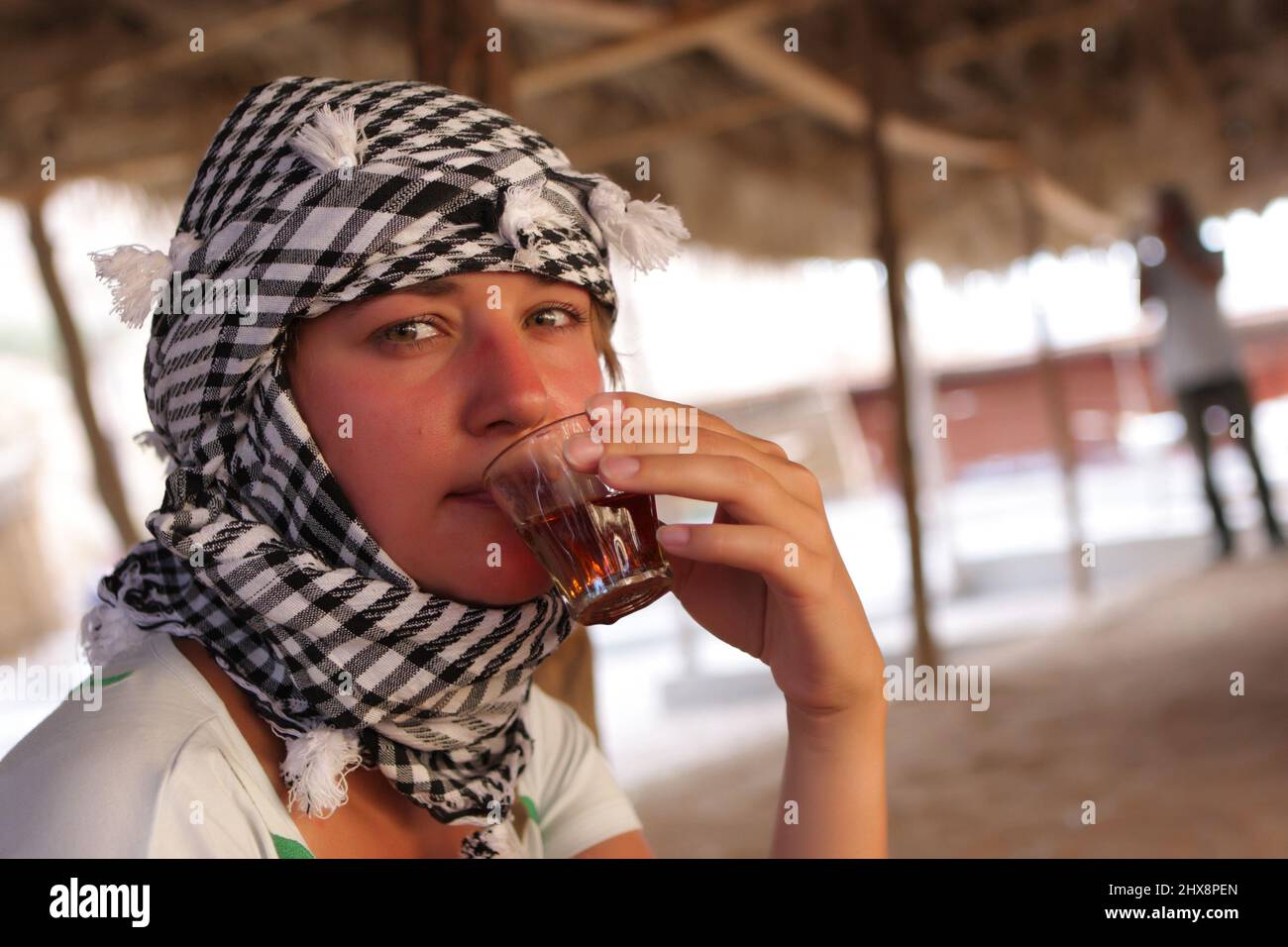 Tourist drinks Bedouin tea in Bedouin tent. Excursion in Egypt Stock ...