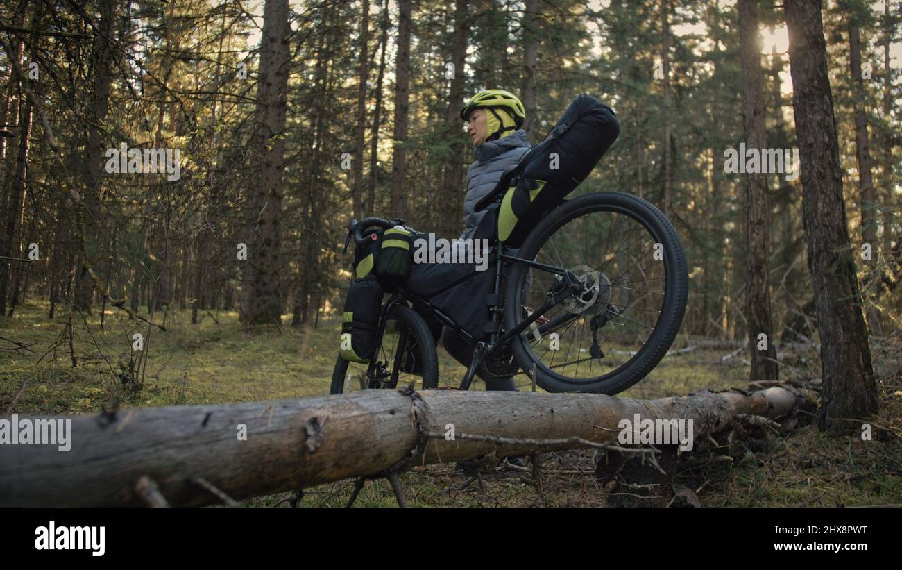 The woman travel on mixed terrain cycle touring with bike bikepacking ...