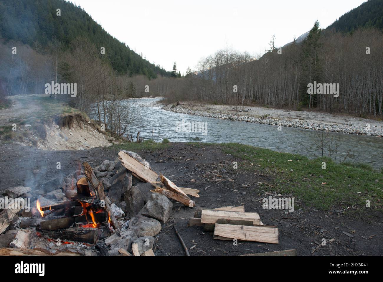 Campfire in the early evening at dispersed campsite along the Skagit ...