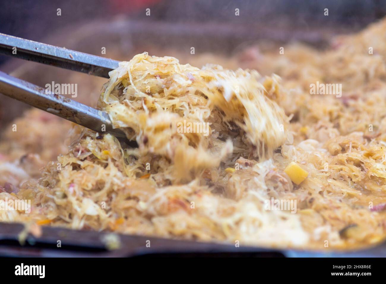 Roasted fresh white cabbage offered on the market Stock Photo - Alamy