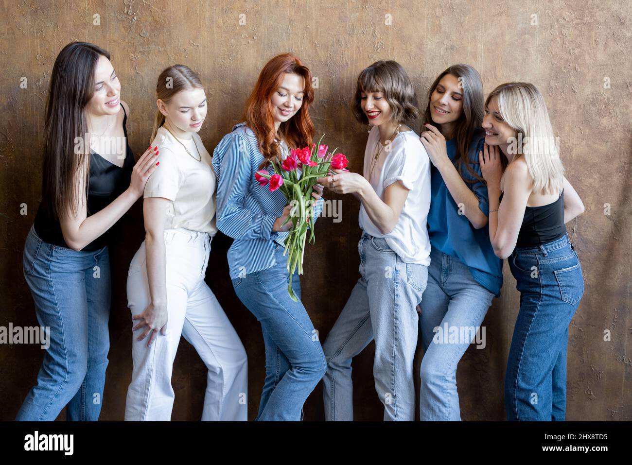 Small group of adult caucasian girlfriends standing together with ...
