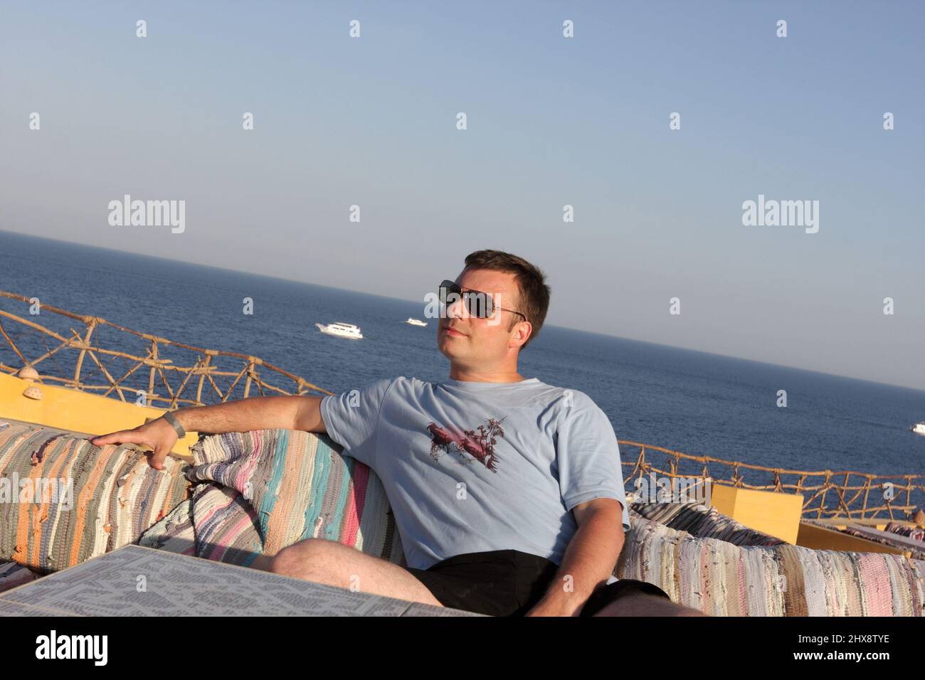 The man rests on a sofa outdoor, Egypt Stock Photo - Alamy