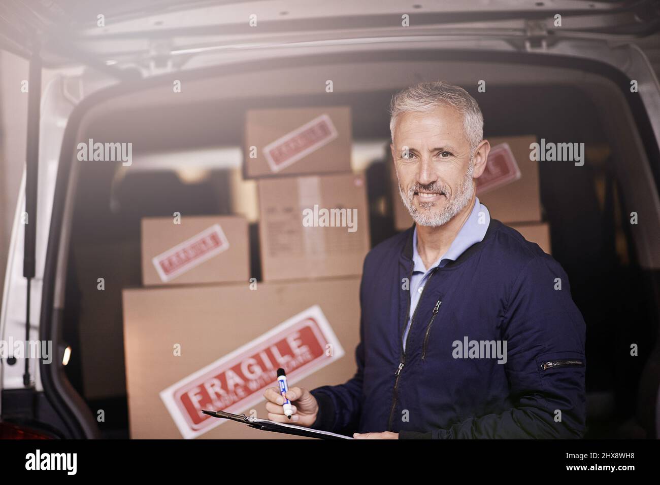Ive got your delivery needs covered. Portrait of a mature delivery man ...