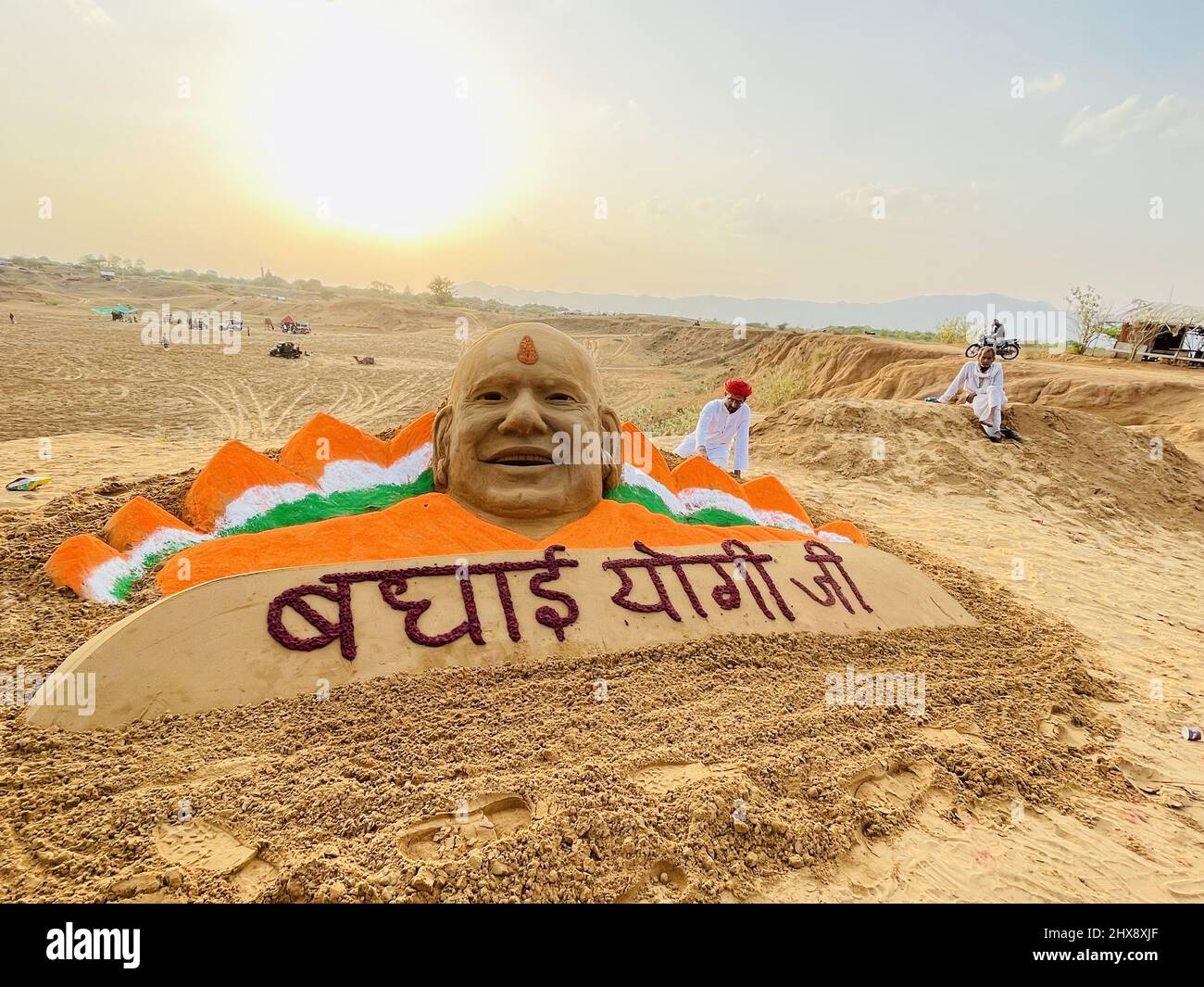 Pushkar, India, March 10, 2022: Sand artist Ajay Rawat creates a ...