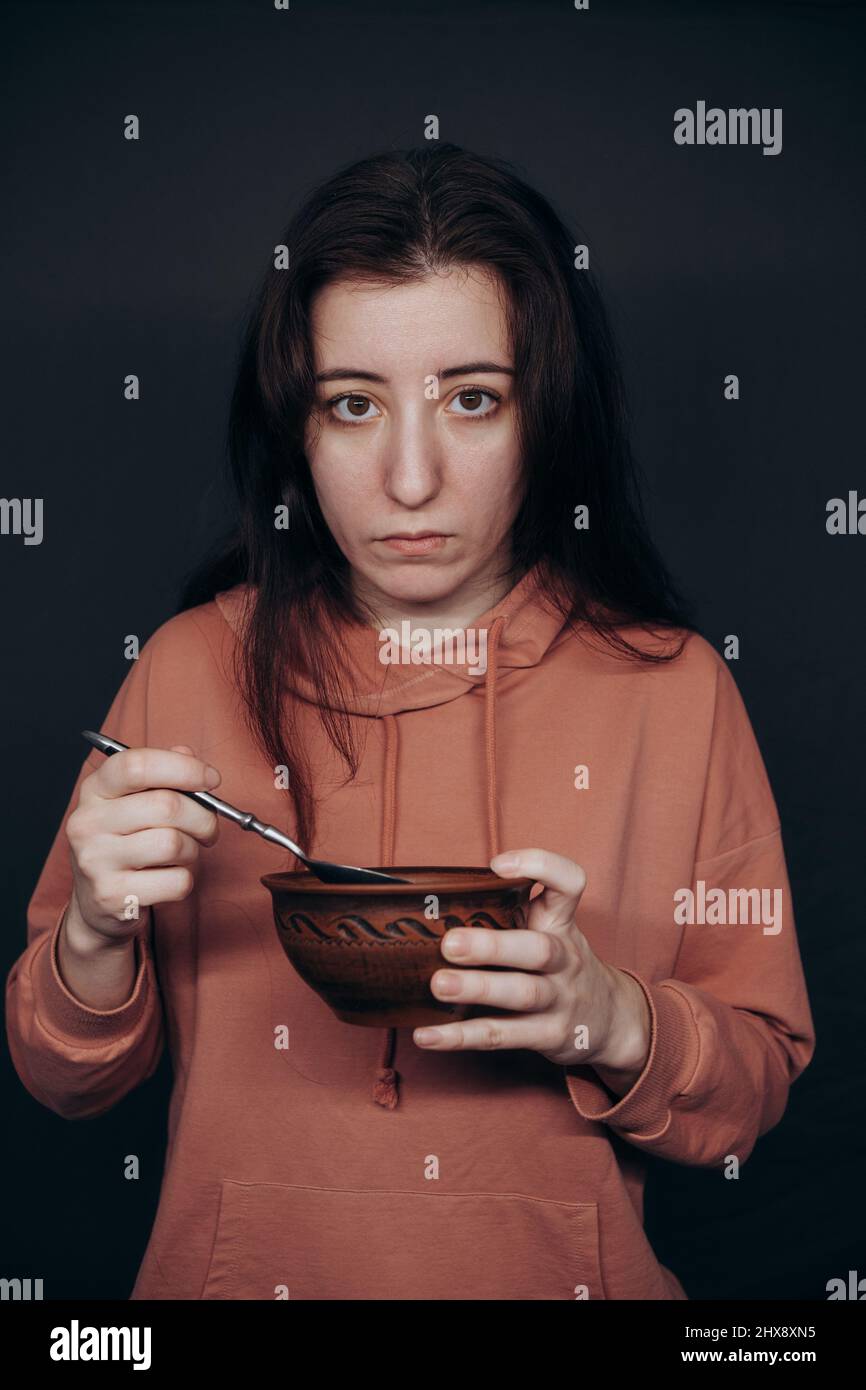 girl close up biting apple on dark bacground Stock Photo - Alamy