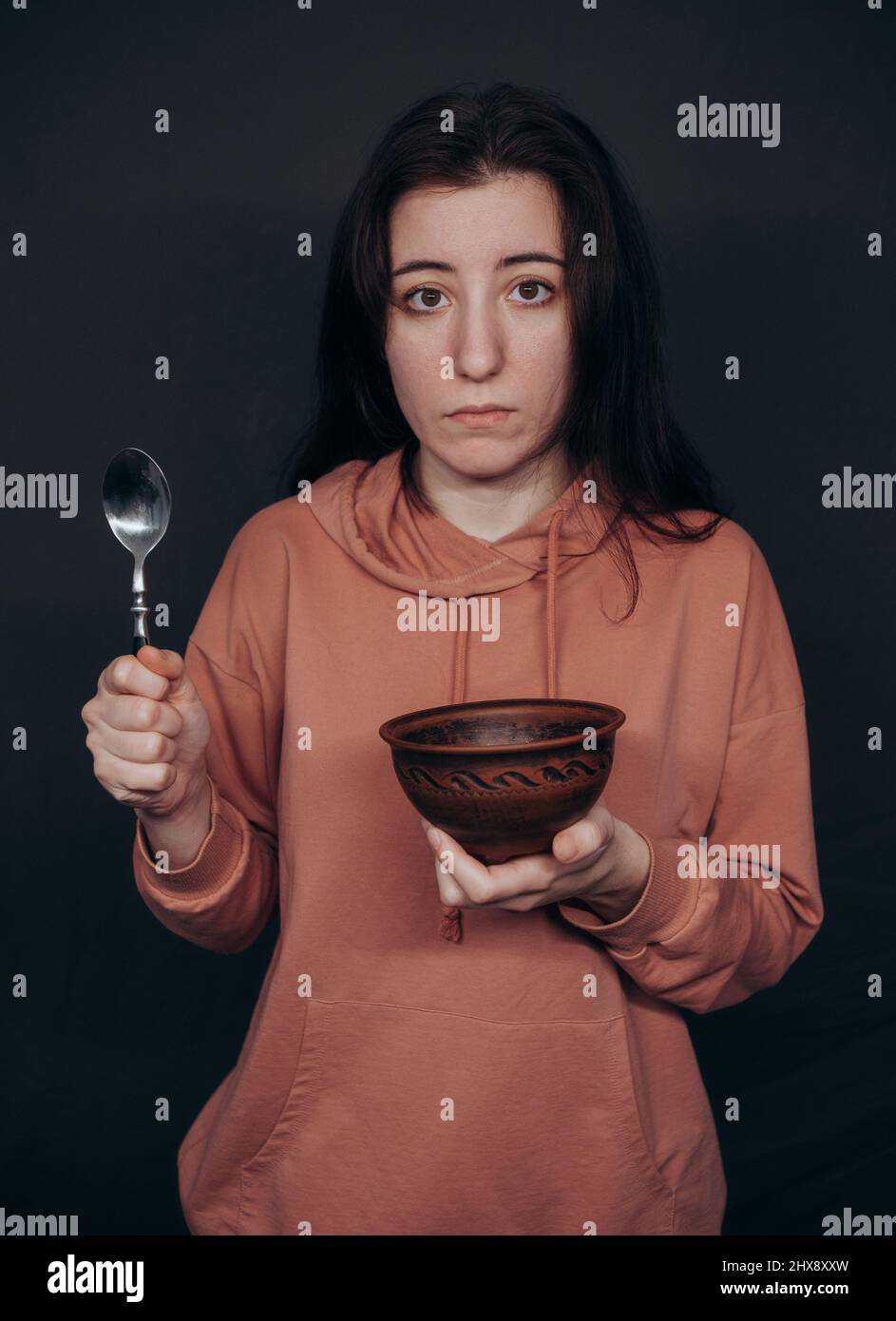 girl close up biting apple on dark bacground Stock Photo - Alamy