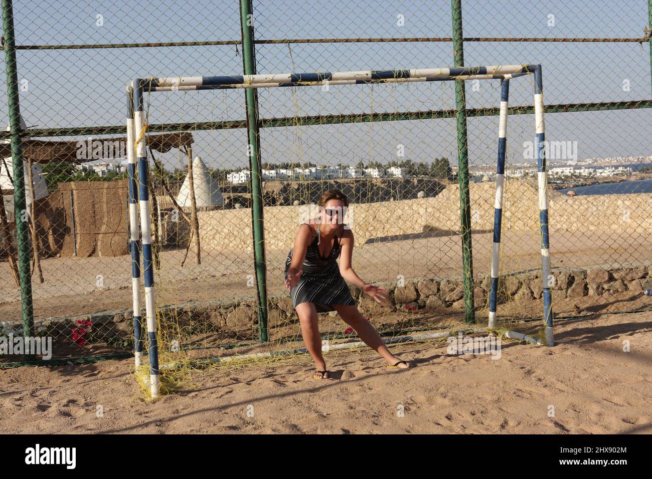 The woman catches a ball on goal line Stock Photo - Alamy
