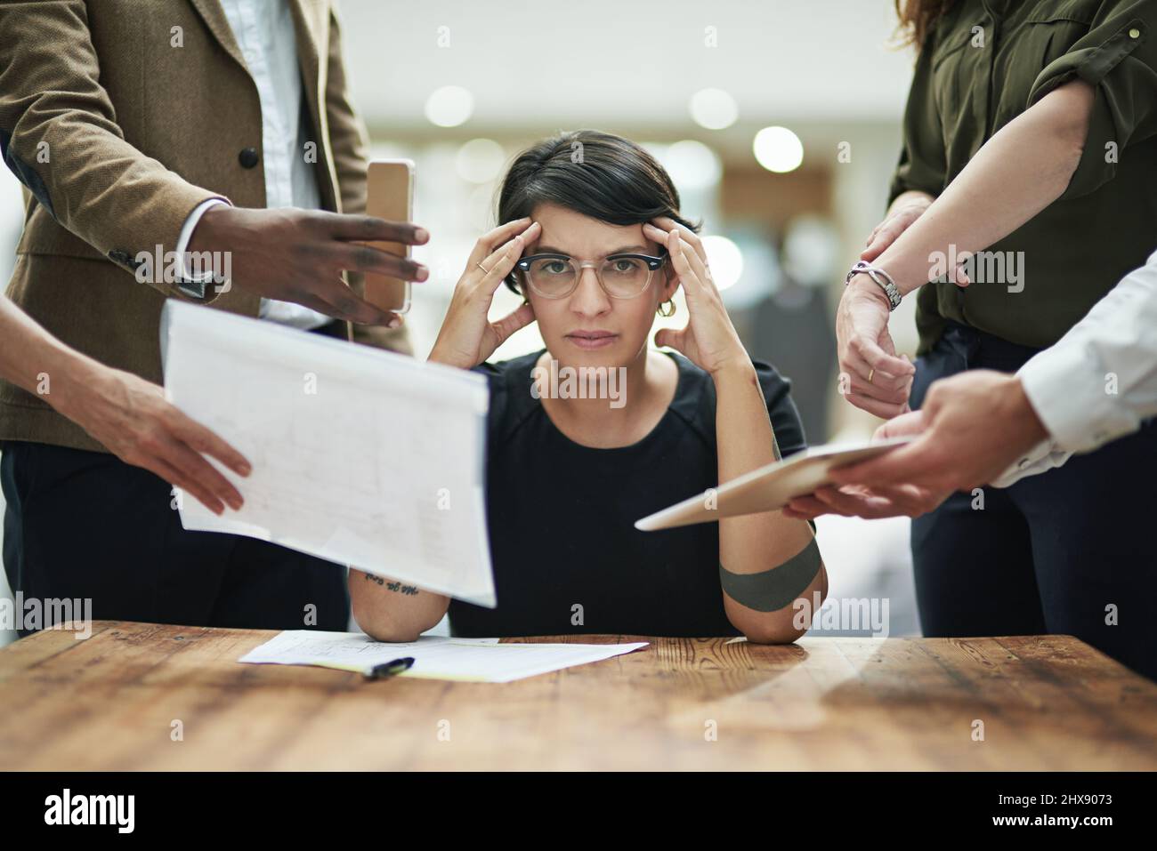 Does anyone have a headache tablet. Cropped portrait of a young ...
