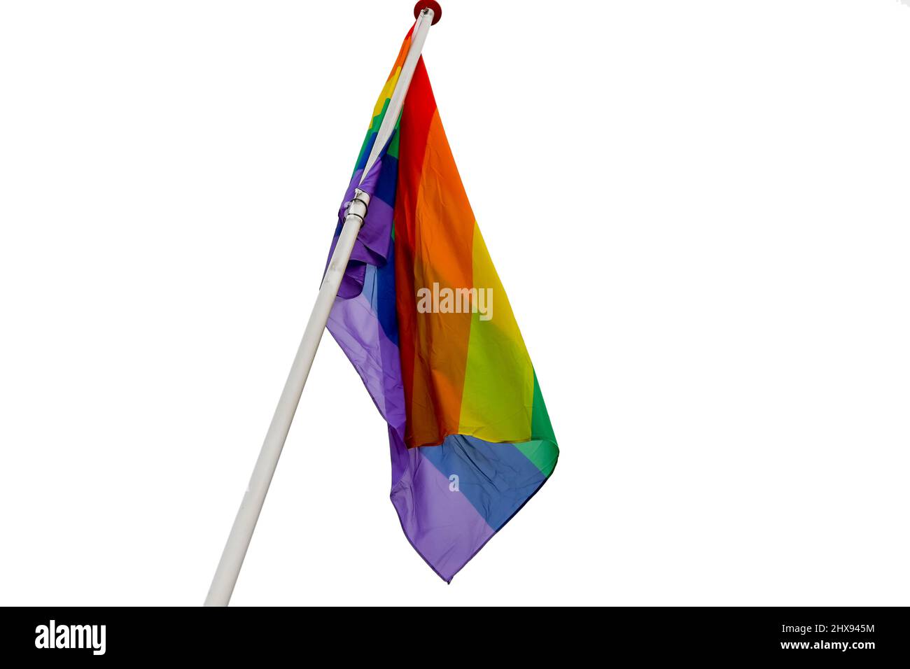 A rainbow flag is hung on the mast, which is visible on a white ...