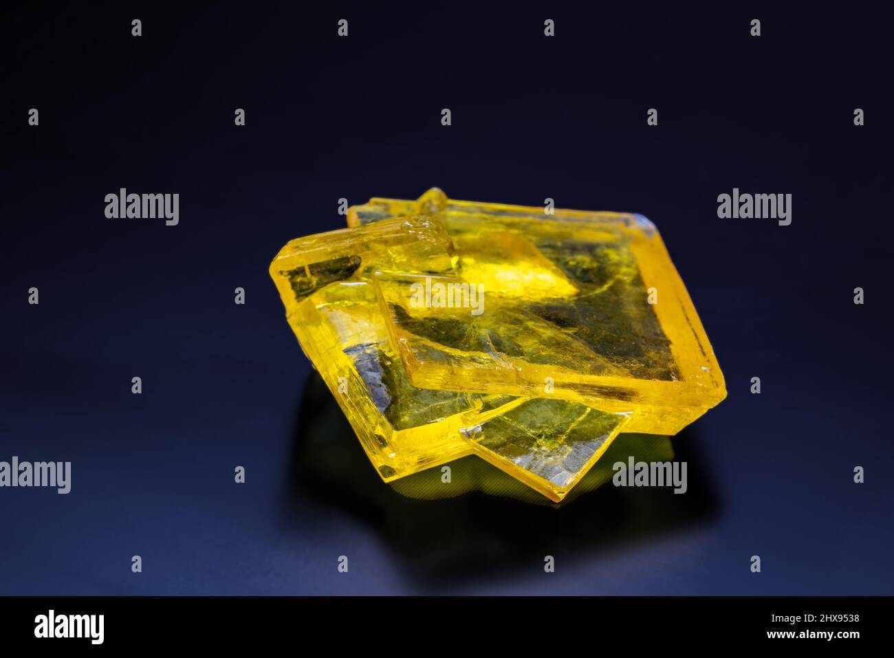 raw mineral crystal on black background. semi-precious yellow crystal ...