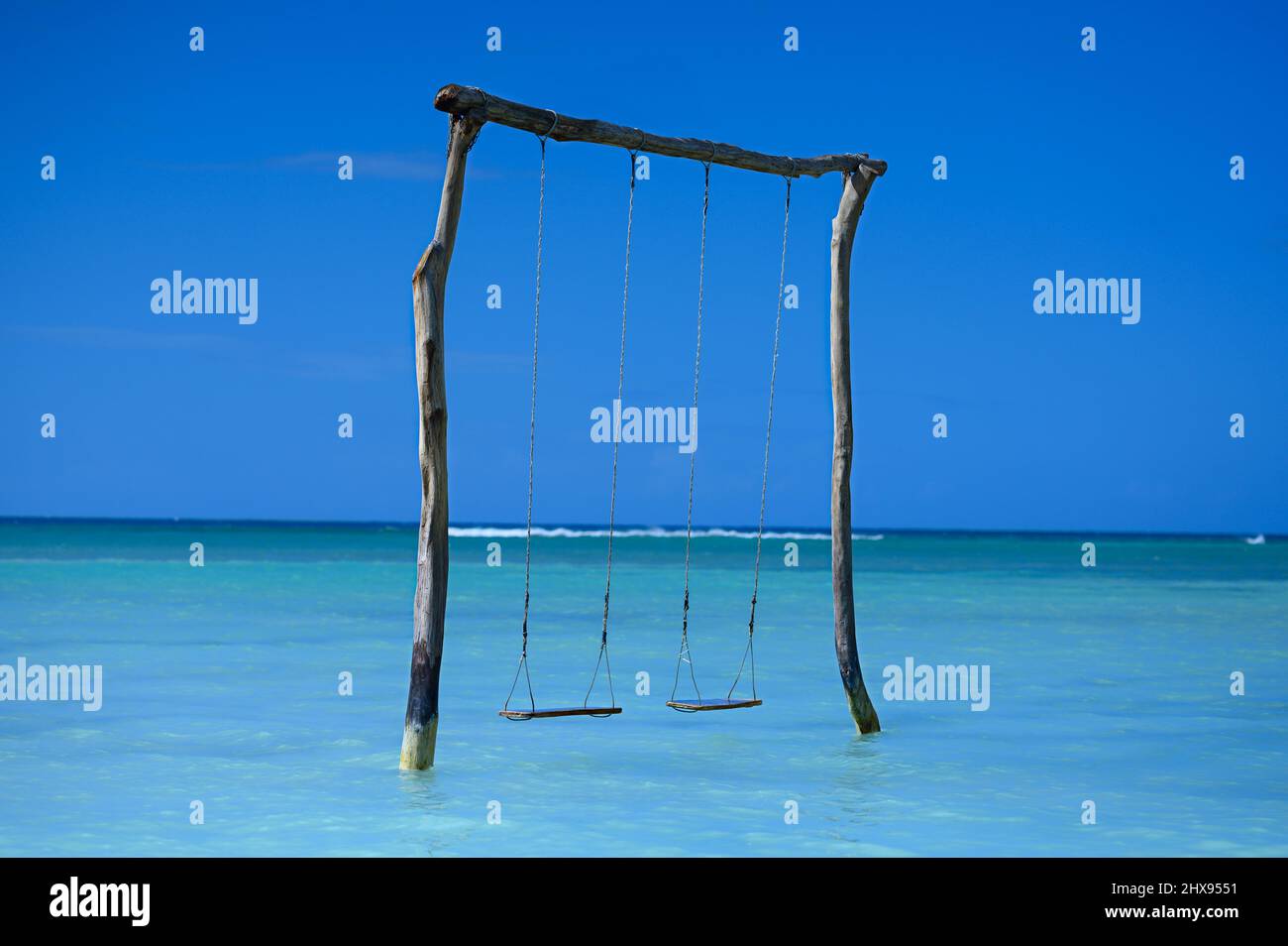 Ocean swing, perfect lagoon. Copy space. Ocean swing with blue sky ...