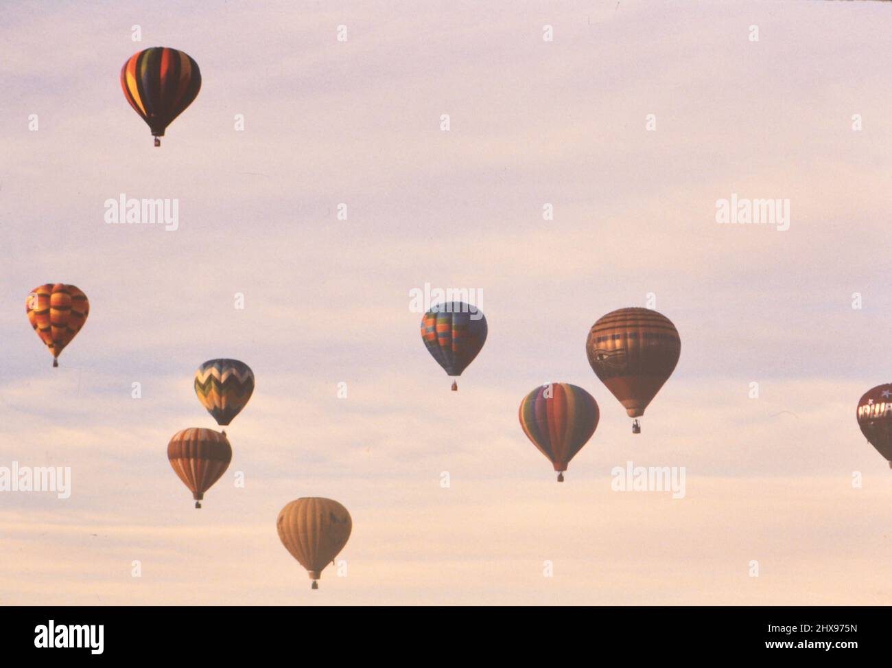 Hot air balloons fill the skies after taking off from a hot air balloon ...