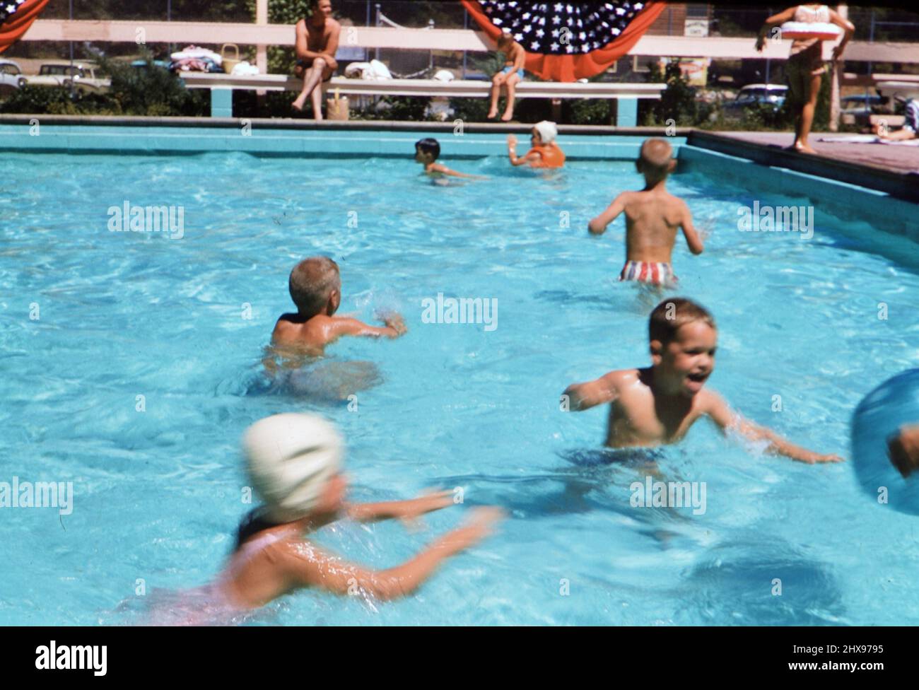 Kids having fun swimming on a sunny summer day ca. 1959 Stock Photo - Alamy