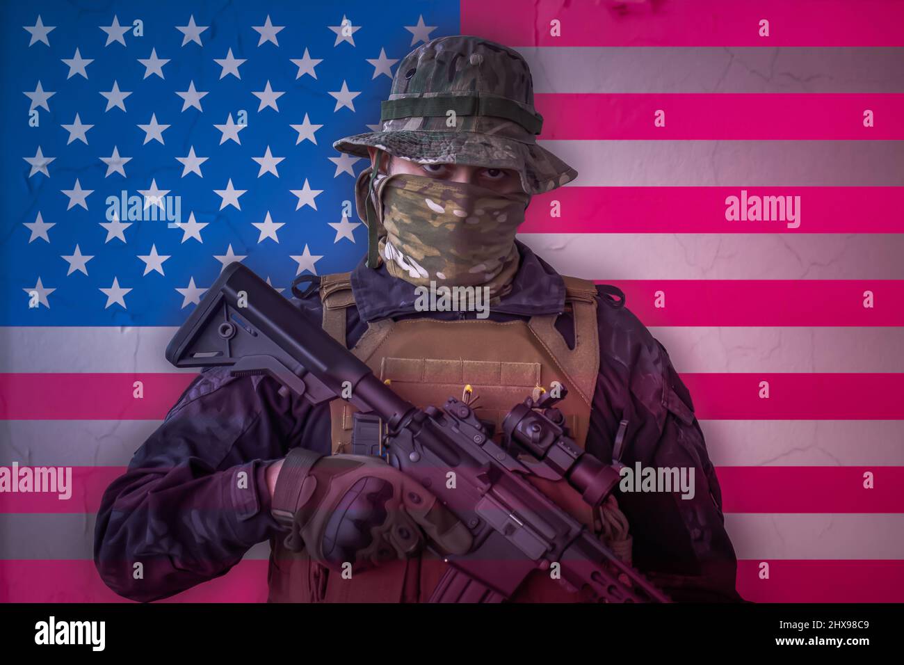 Angry american soldier armed with rifle with usa flag as background ...