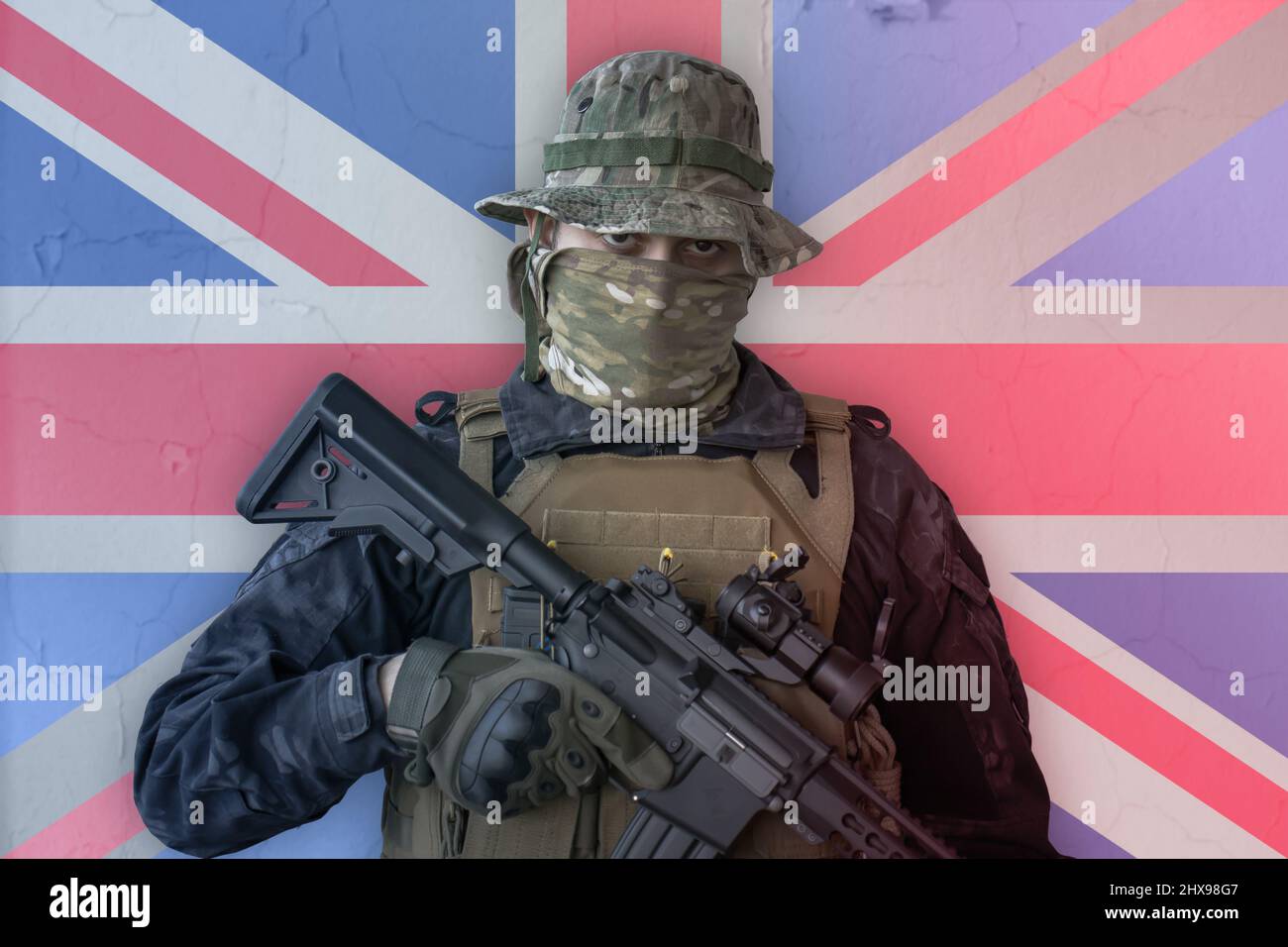 Angry english soldier armed with rifle with england flag as background ...