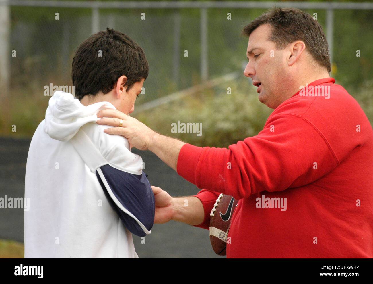 Injured young football player with sad face and arm in cast from ...