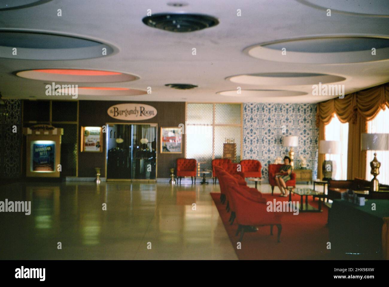 Lobby of a luxury hotel, The Burgandy Room lounge entrance, woman ...