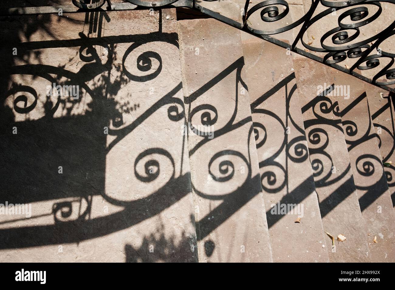 Brownstone stoop with wrought iron cast shadows Stock Photo - Alamy