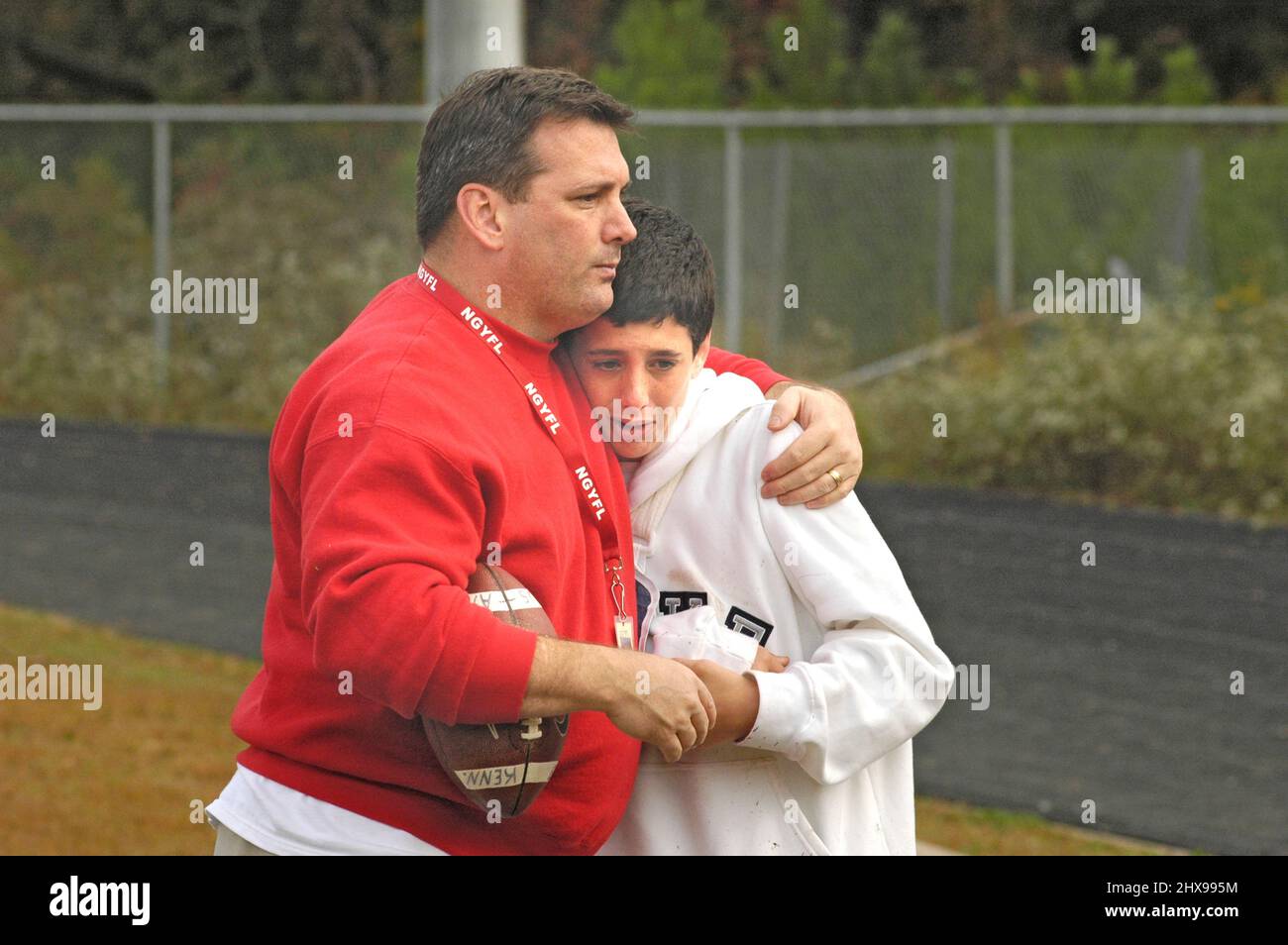 Injured young football player with sad face and arm in cast from ...
