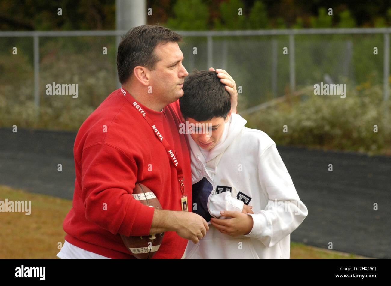 Injured young football player with sad face and arm in cast from ...