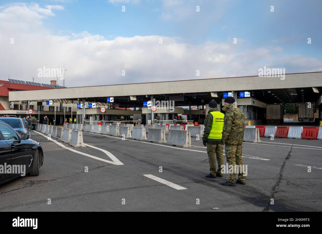 Korczowa, Poland. 10th Mar, 2022. Polish border guards are standing at ...
