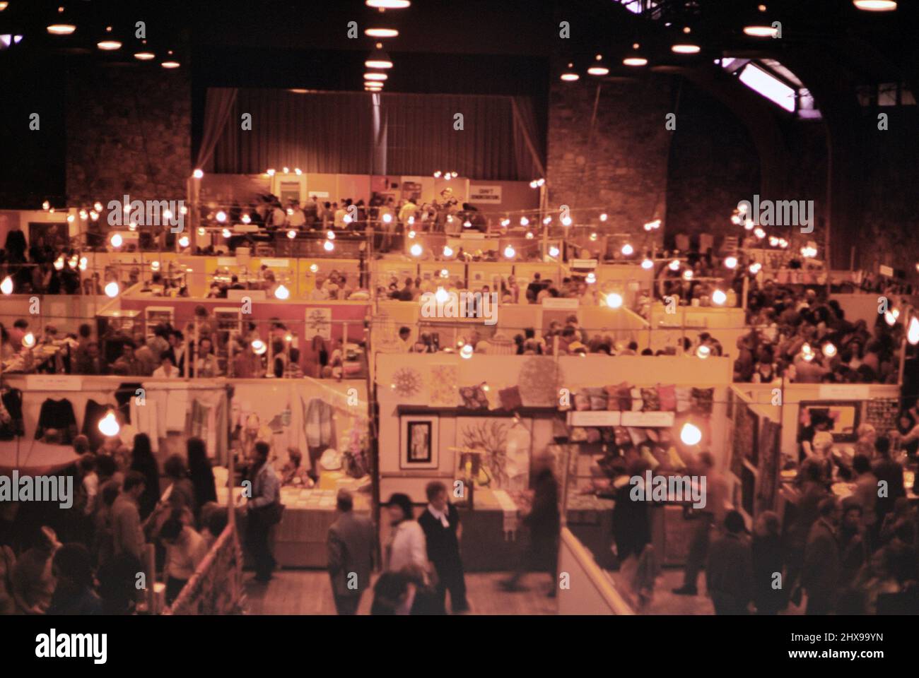 Displays inside a crowded exhibit hall ca. 1972 Stock Photo - Alamy