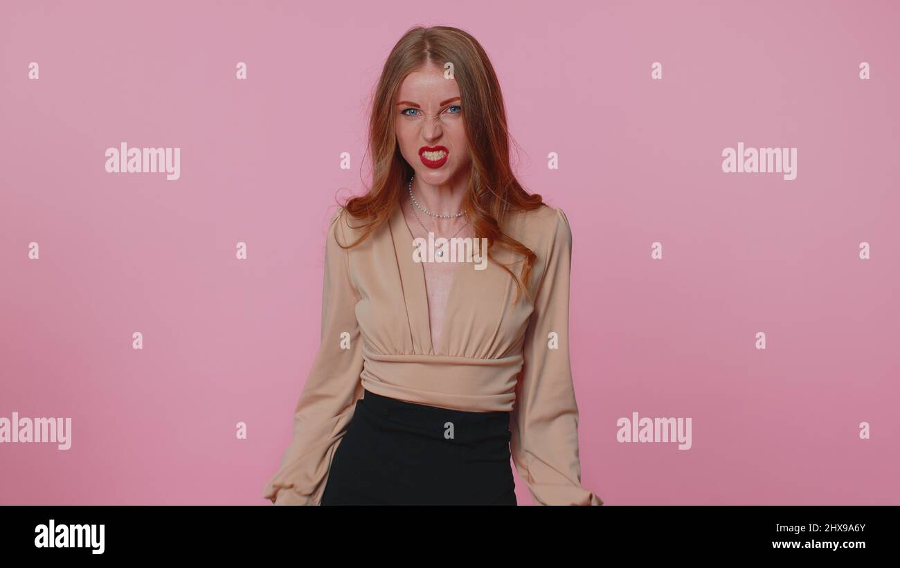 Upset businesswoman raising hands in indignant expression, quarreling ...