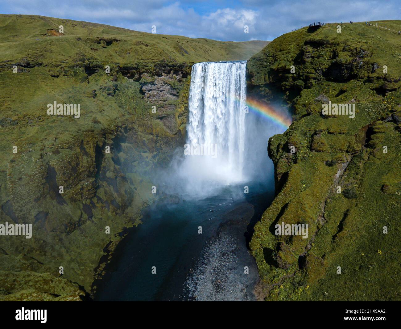 Beautiful aerial view of the huge Skogafoss waterfall and its rainbow ...