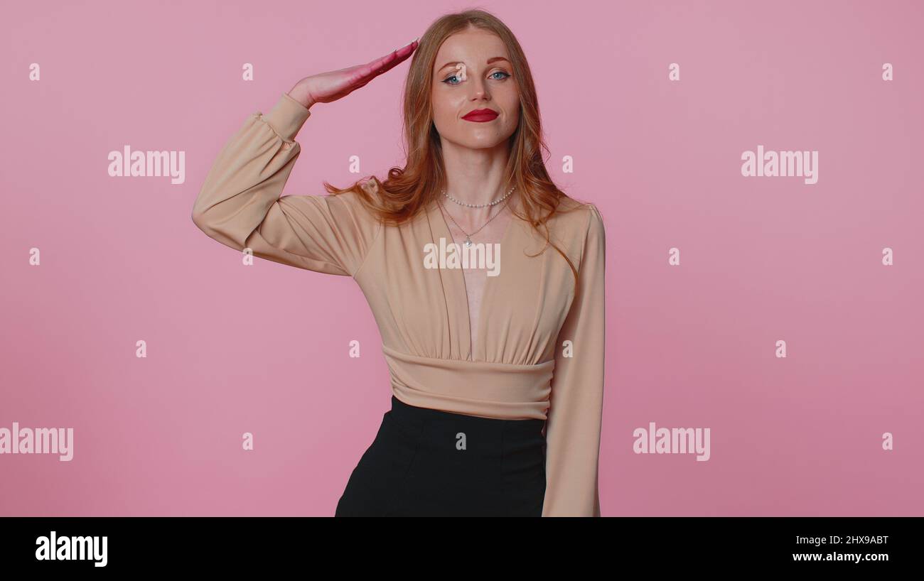 Responsible woman giving salute listening to order as if soldier ...