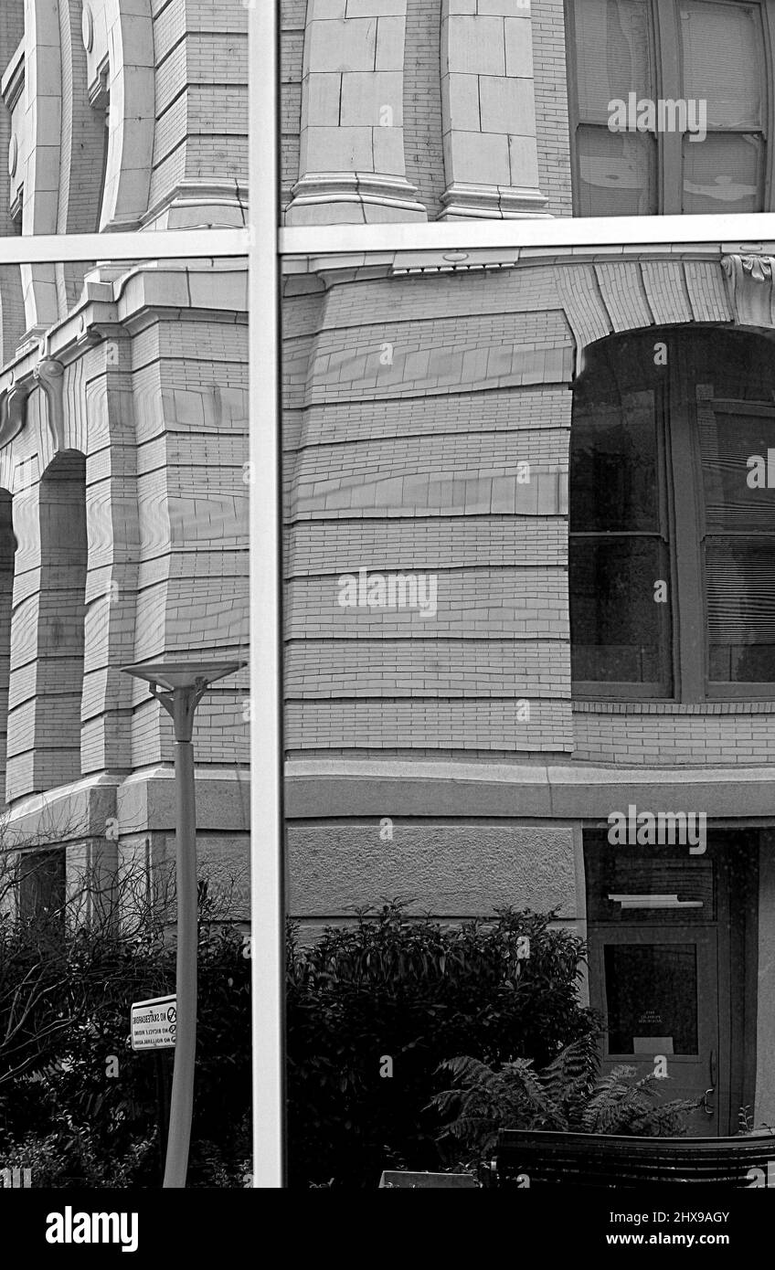 Black and White Image of Reflection of Old Stone Building in a Window ...