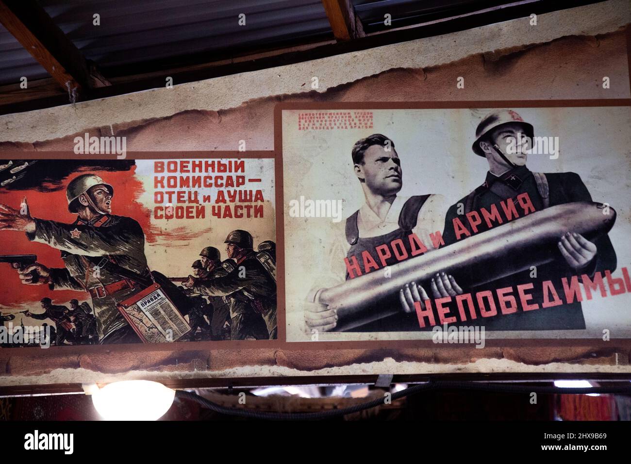 Soviet placards on a wall on territory in the Izmailovsky Kremlin in ...
