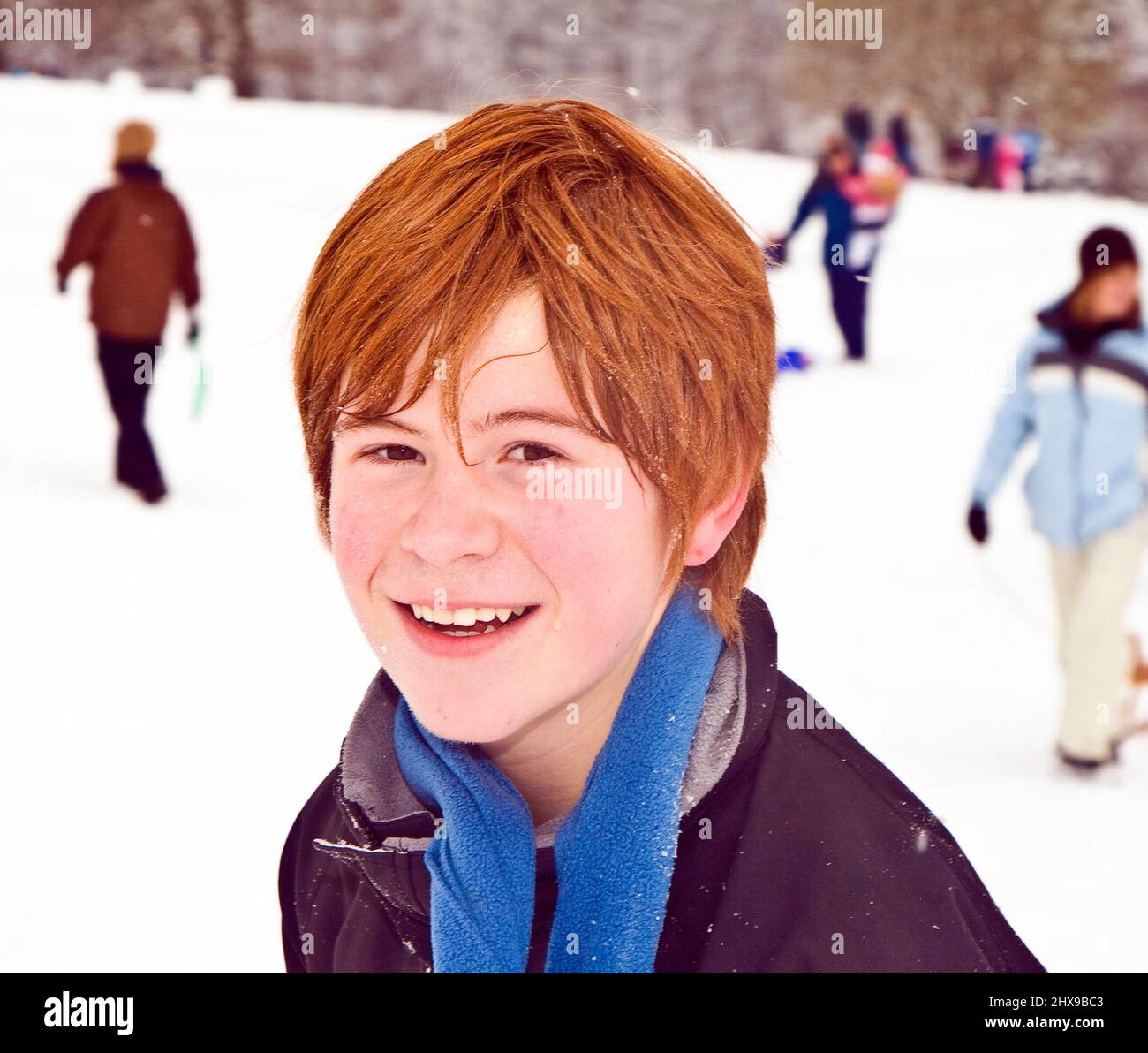 Happy kids playing snowball fight hi-res stock photography and images ...
