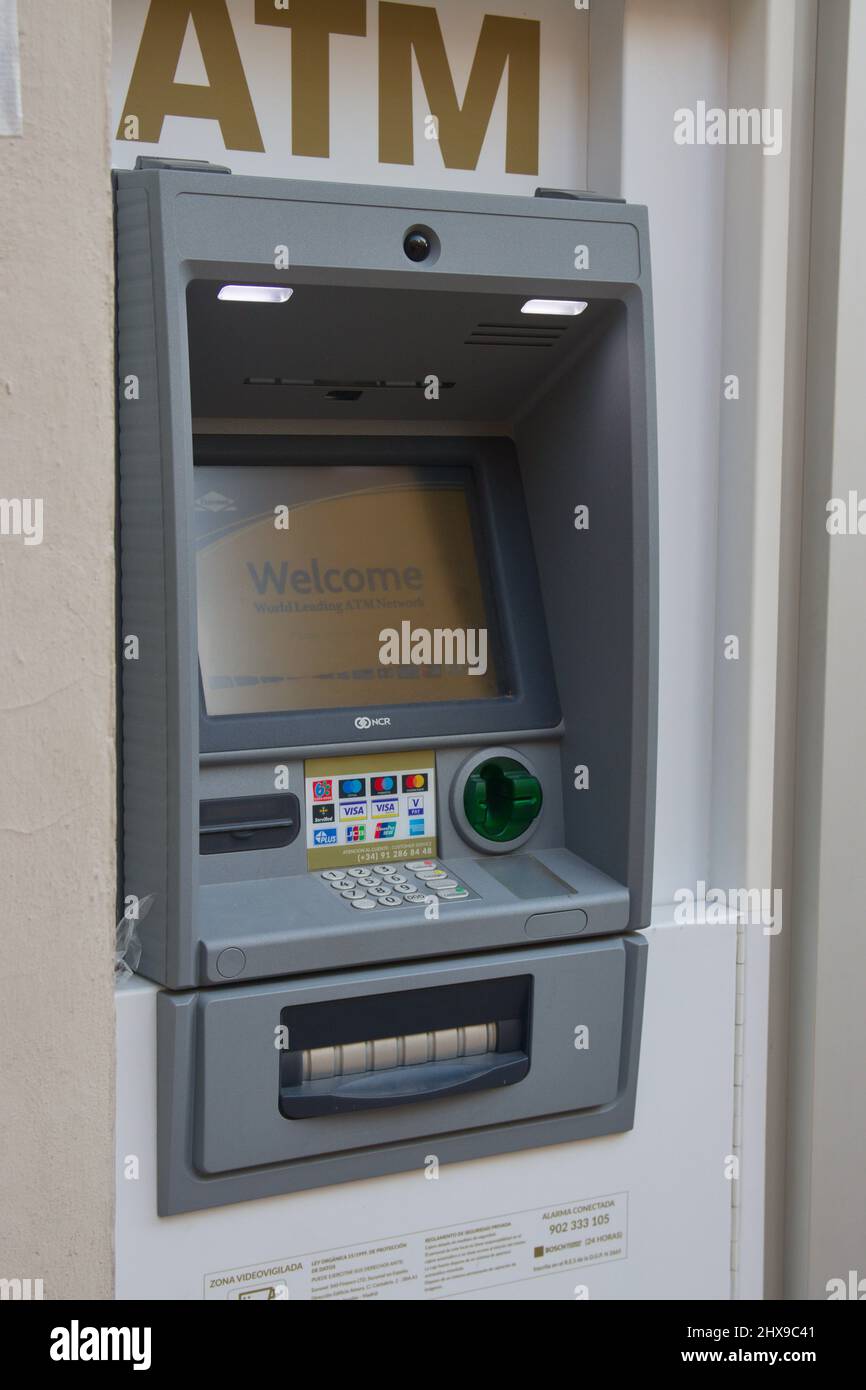 2022. Valencia, Spain. Image of an ATM that accepts several types of ...