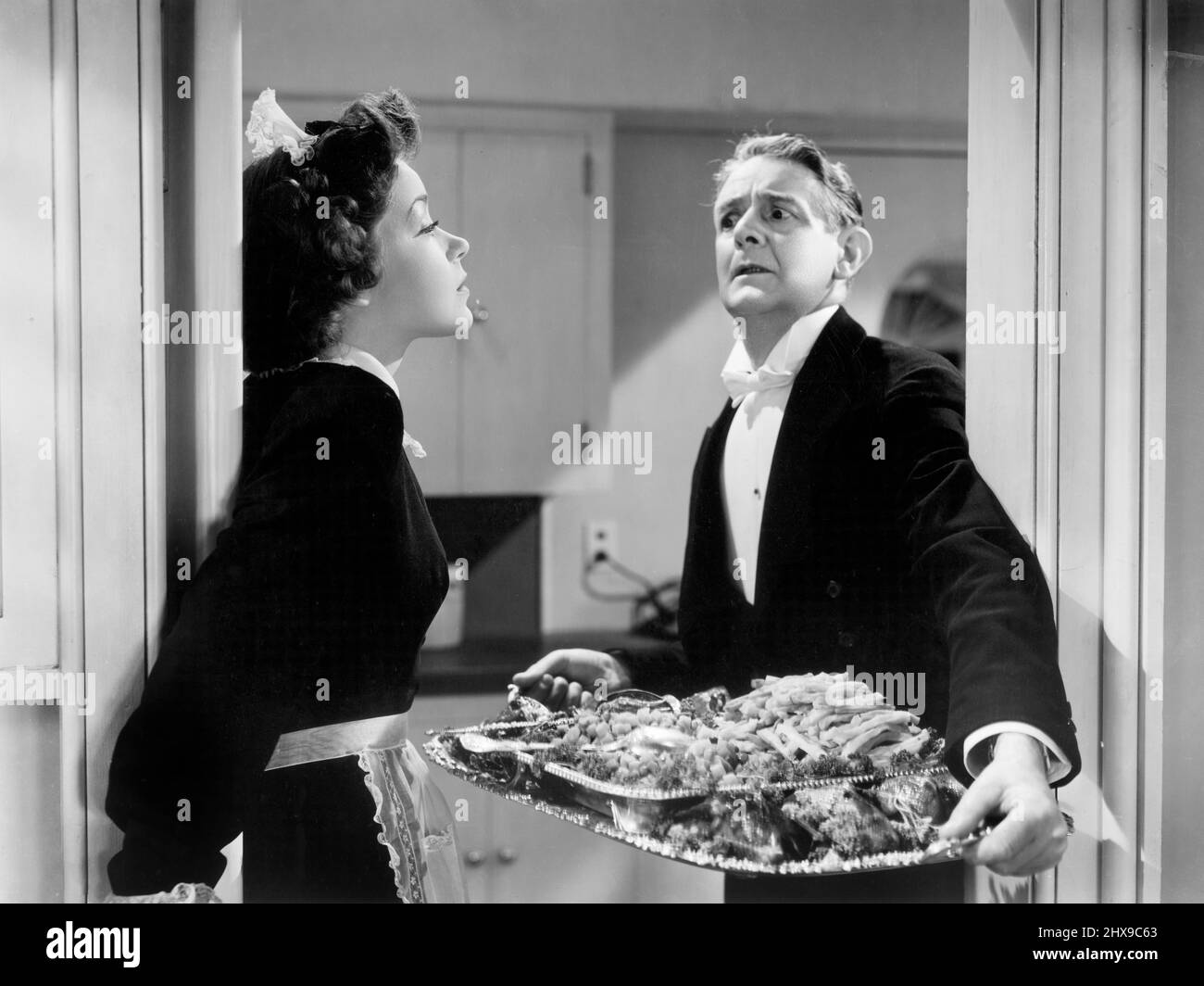 Marsha Hunt, Leonard Carey, on-set of the Film, "The Affairs of Martha ...
