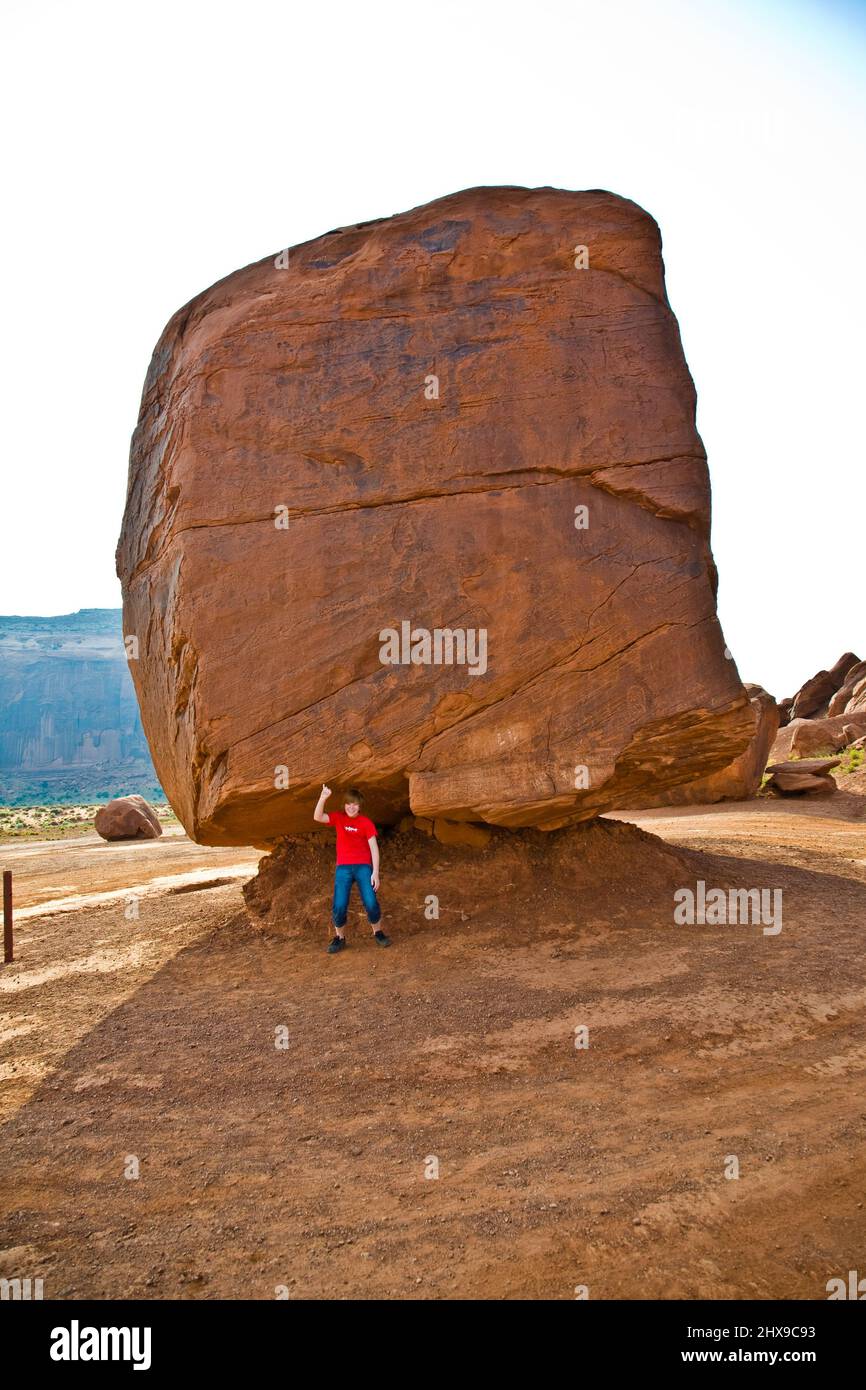 Boy leaning on rock formation hi-res stock photography and images - Alamy
