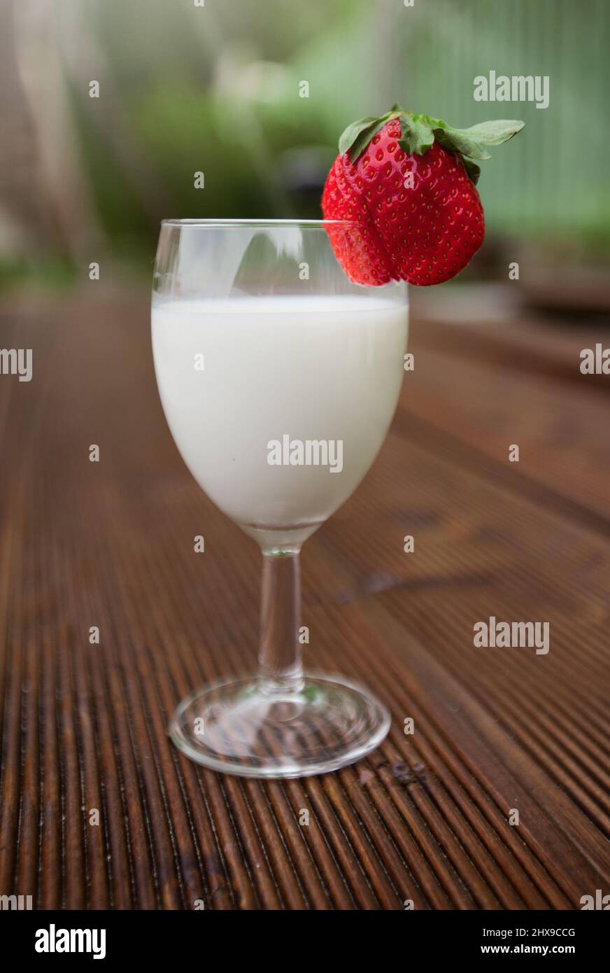 Tasty yoghurt with fresh strawberry over wooden background Stock Photo ...