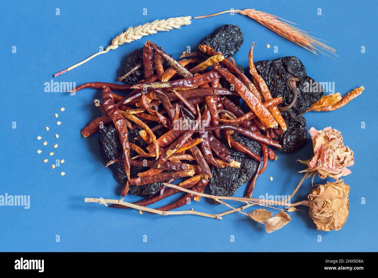 Abstract still life composition with vegetables, cereals, and flowers ...