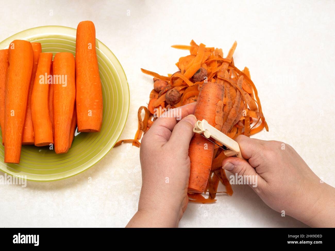 Chef hands peeling carrots using hi-res stock photography and images ...