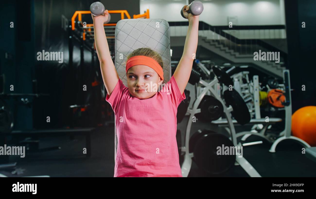 Fit Athletic Baby Girl Work out with Dumbbell, Doing Her Fitness ...