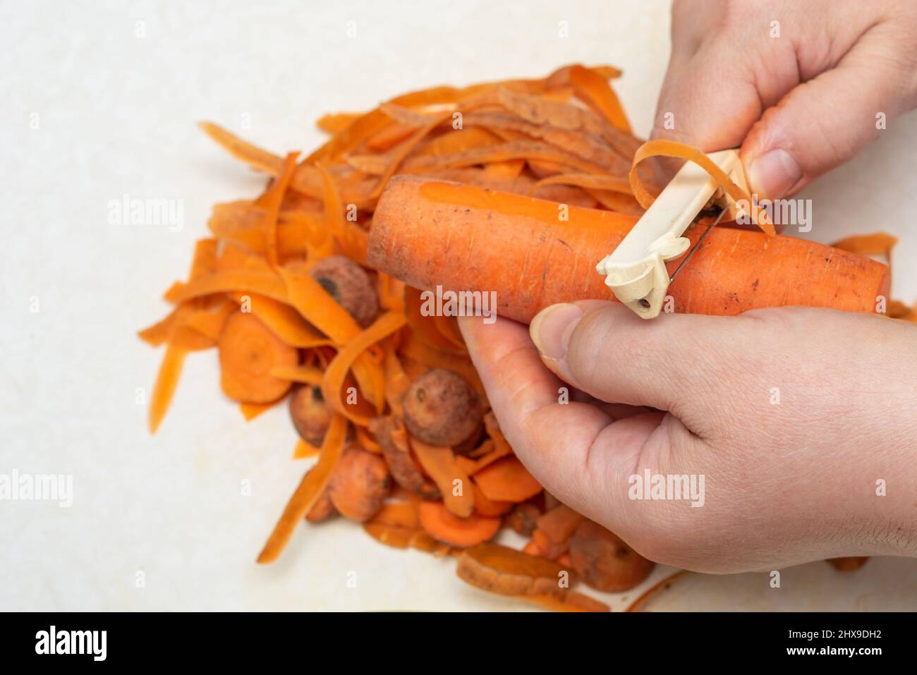 Woman peeling off carrot knife hi-res stock photography and images - Alamy