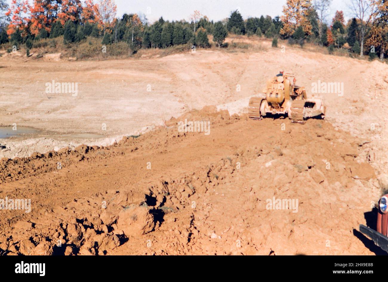 Bulldozer being driven at a construction site ca. 1960 Stock Photo - Alamy