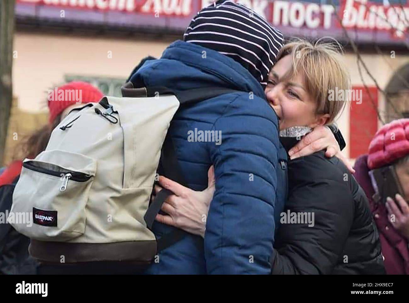 Kyiv, Ukraine. 10th Mar, 2022. Two people hug goodbye in Irpin, Ukraine ...