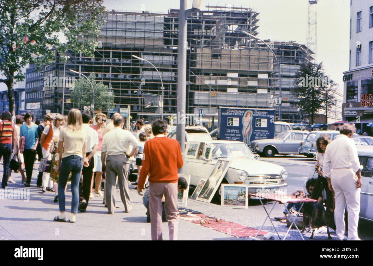 Pedestrian street scene in a West German city, building construction in ...