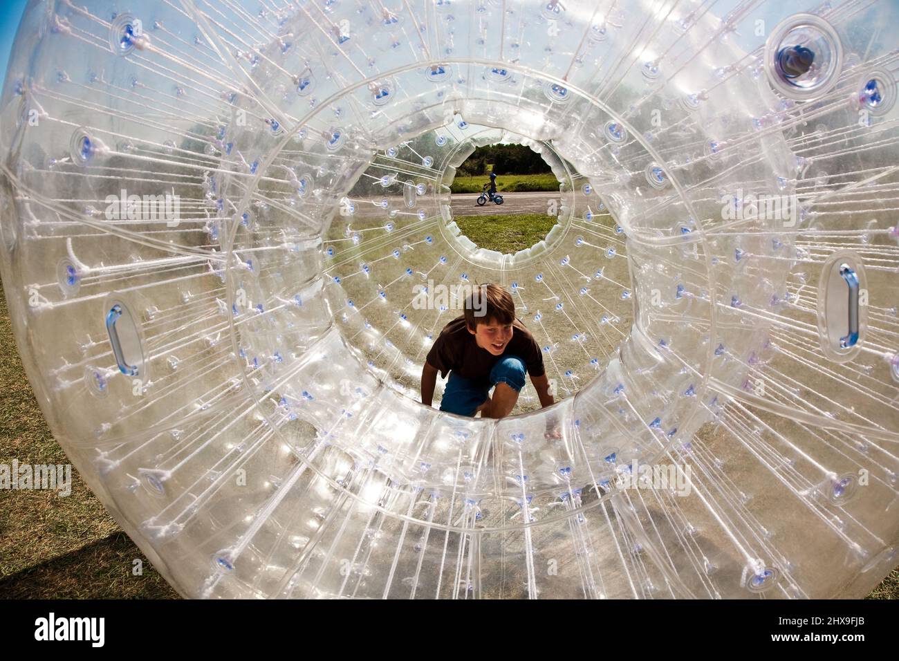 child has a lot of fun in the Zorbing Ball Stock Photo - Alamy
