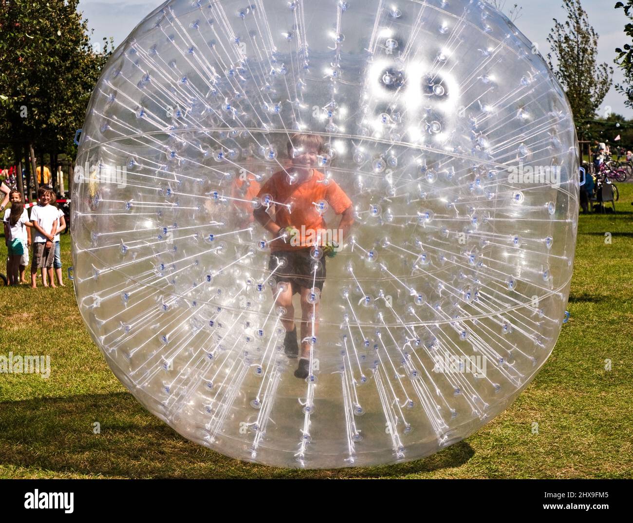 child has a lot of fun in the Zorbing Ball Stock Photo - Alamy