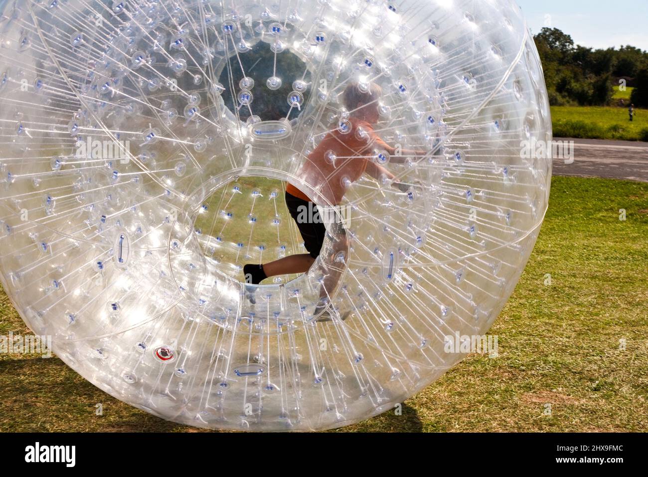 child has a lot of fun in the Zorbing Ball Stock Photo - Alamy